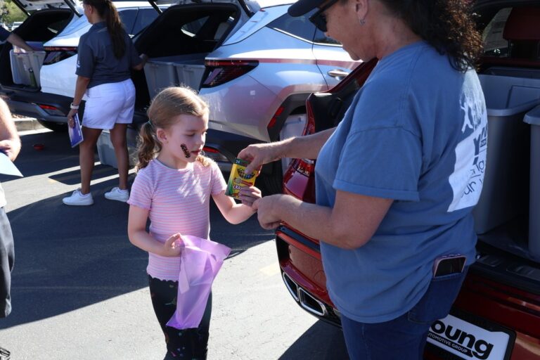 New Bridge Elementary School students receive supplies for class during ...